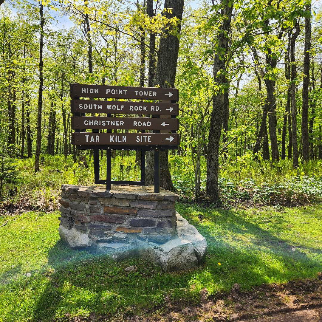 Photo: Park Directional Signage at the Gravel Road Entrance to the ...